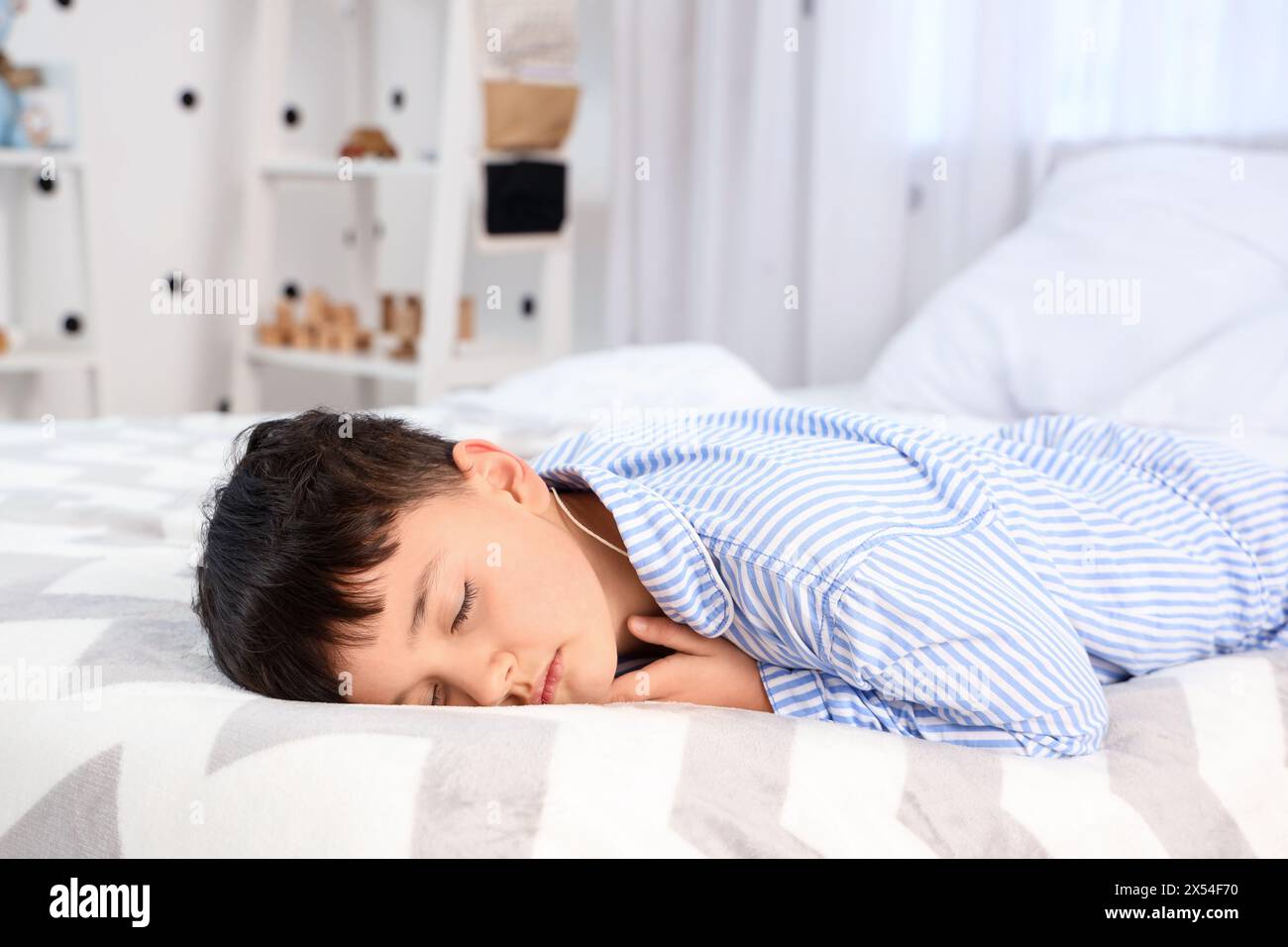 Cute little boy sleeping in bedroom Stock Photo - Alamy