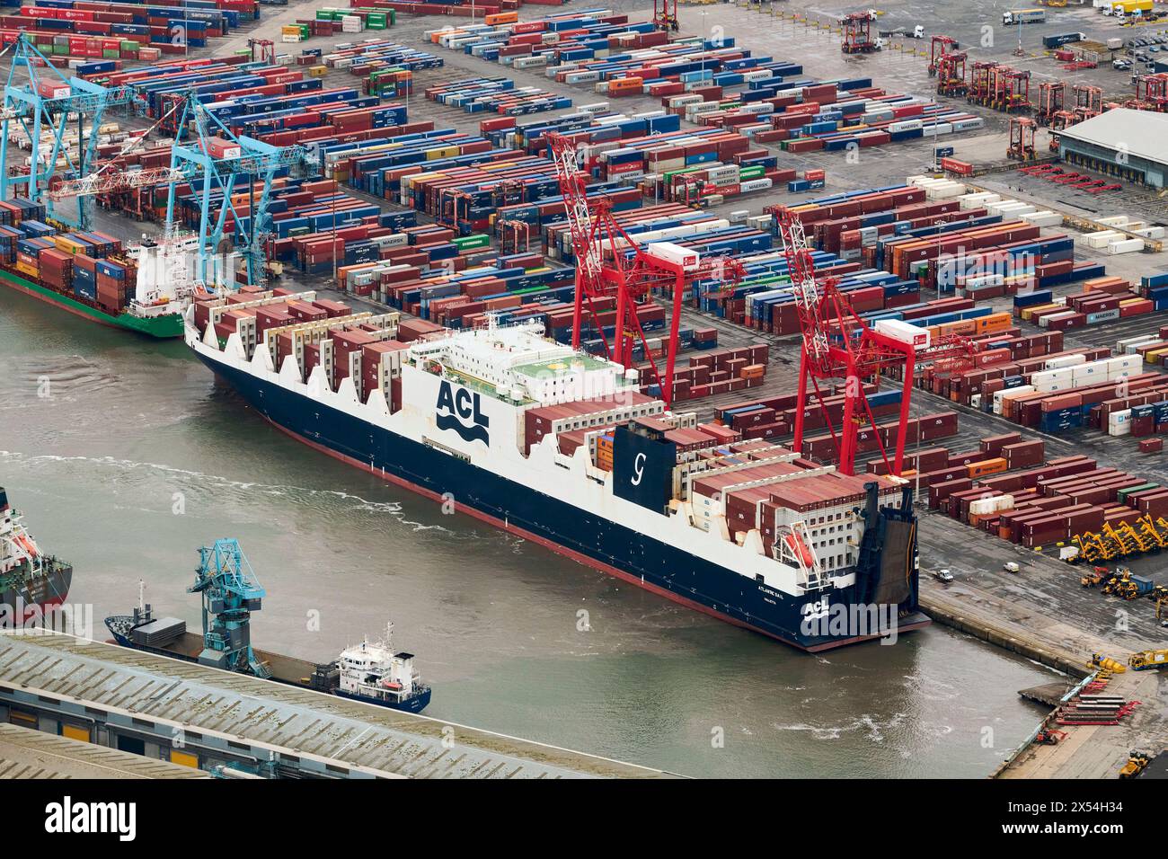 An aerial view of Liverpool Docks with a container ship loading ...