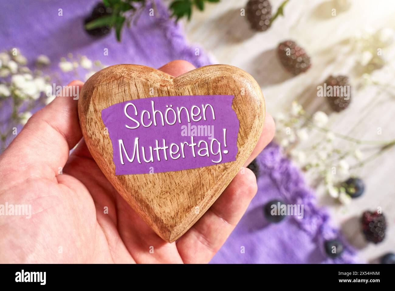 7 May 2024: Happy Mother s Day Greeting on a heart held by a man ...