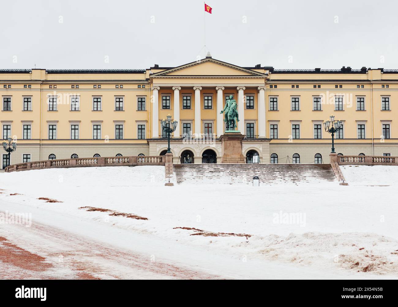 Facade of Neoclassical Oslo Royal Palace in winter with Norwegian royal ...