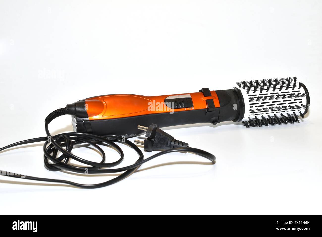 Electric hair dryer brush for creating volume in a woman's hairstyle on ...