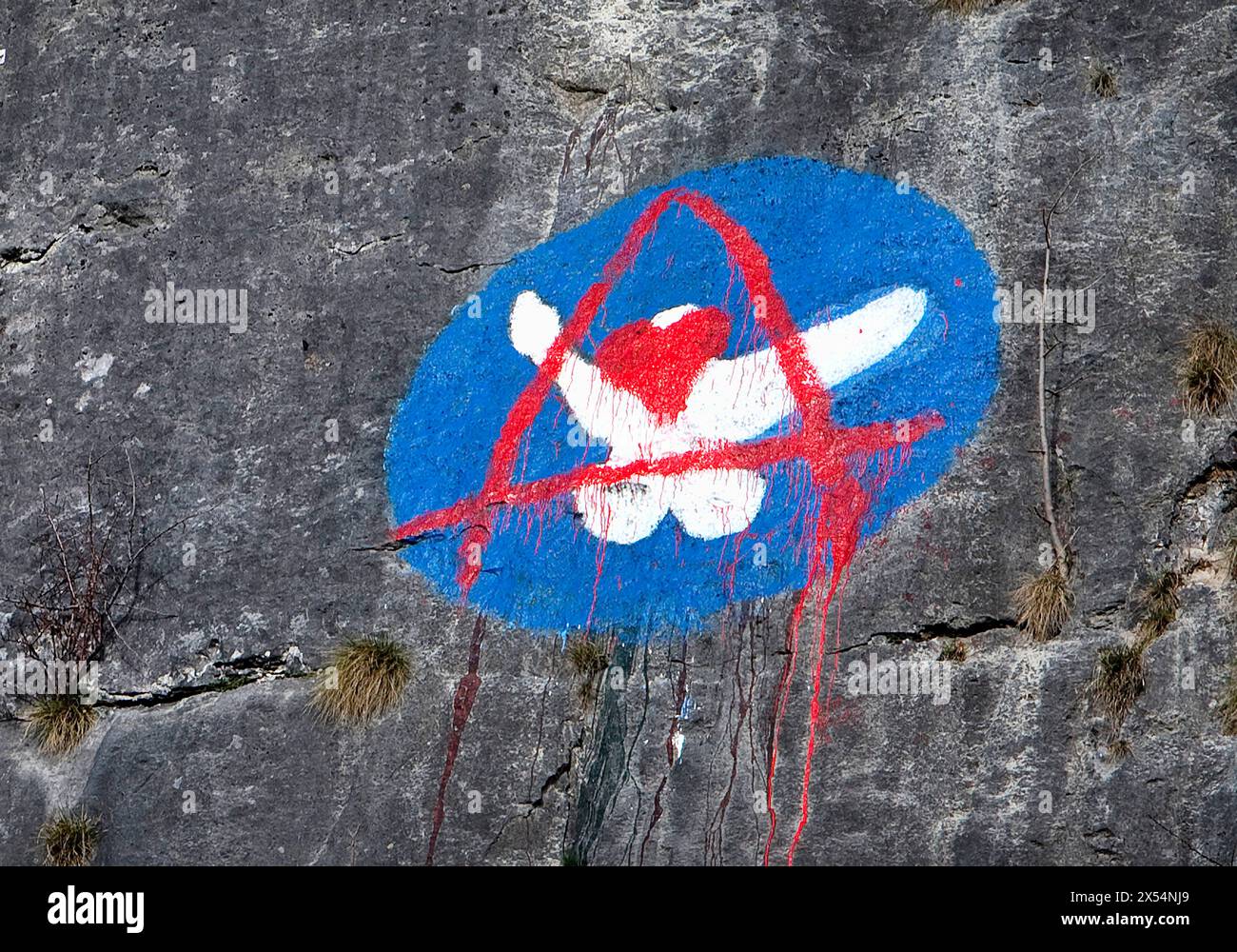 painting on a steep rock face in the Hoenne Valley, Germany, North ...