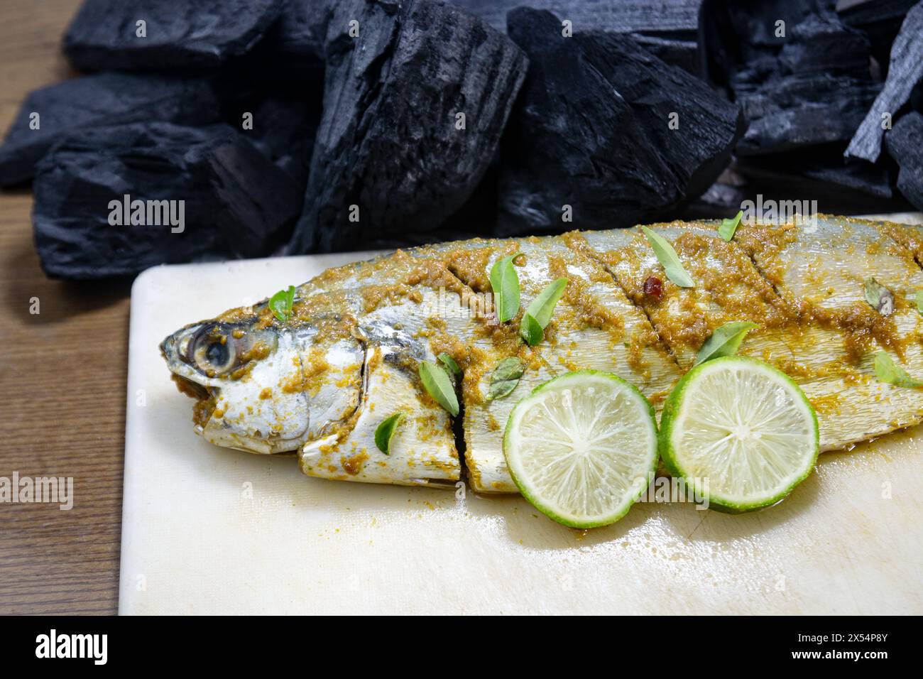 Fish BBQ. Marinated fish with salt pepper, green chili and turmeric ...