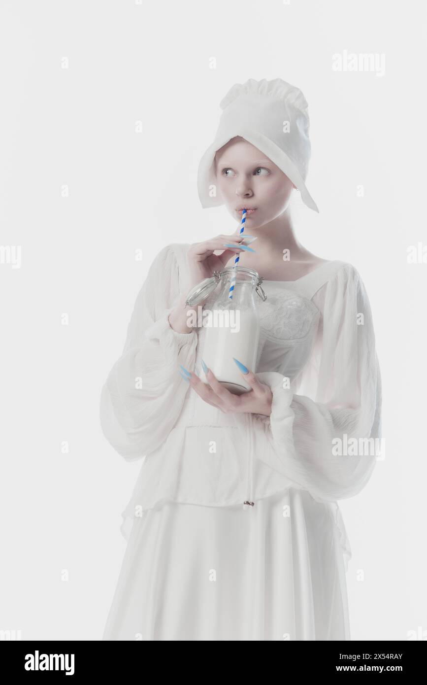 Beautiful young woman dressed as medieval person, maid in white ...