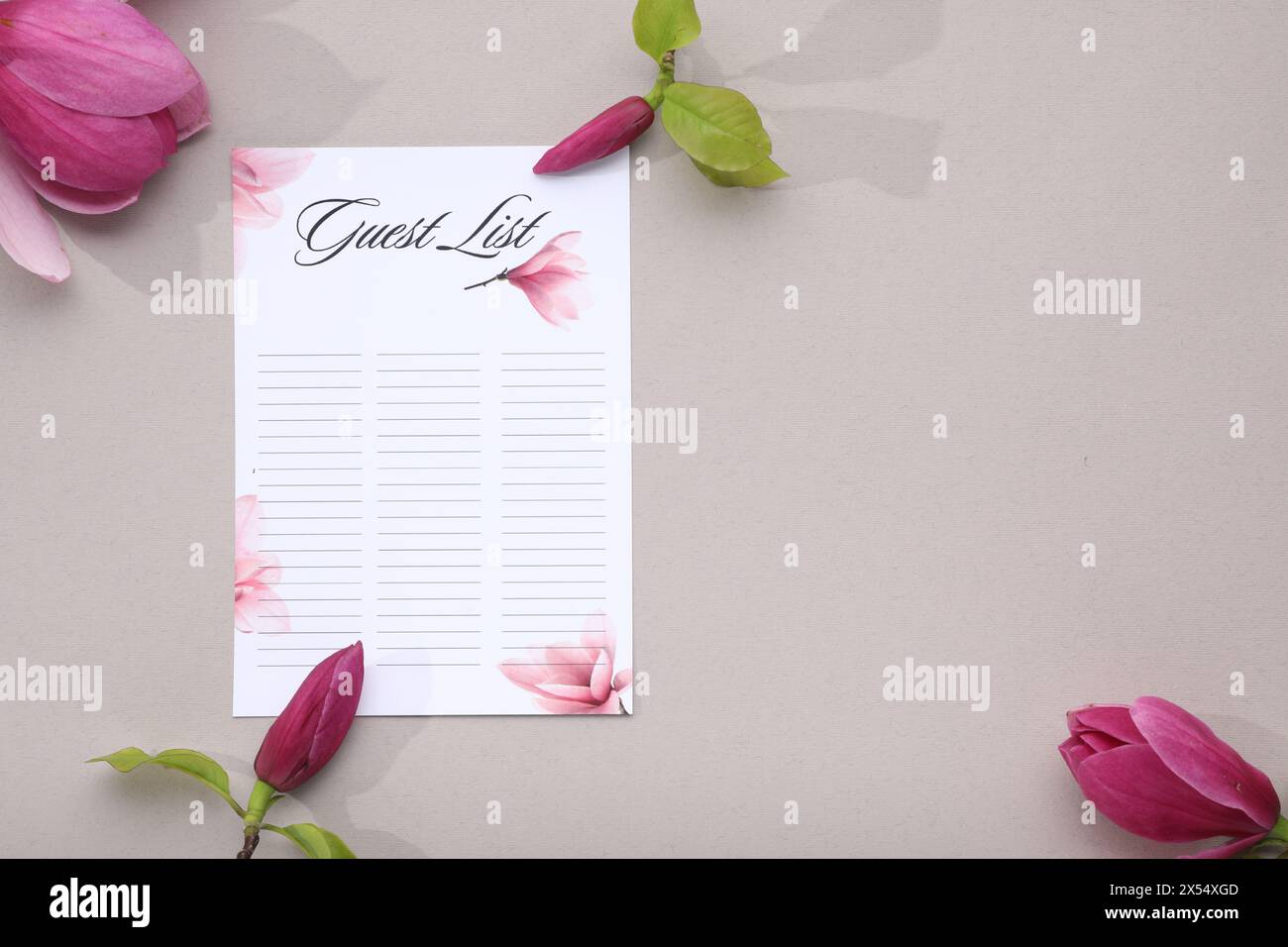 Guest list and beautiful flowers on grey background, flat lay. Space ...