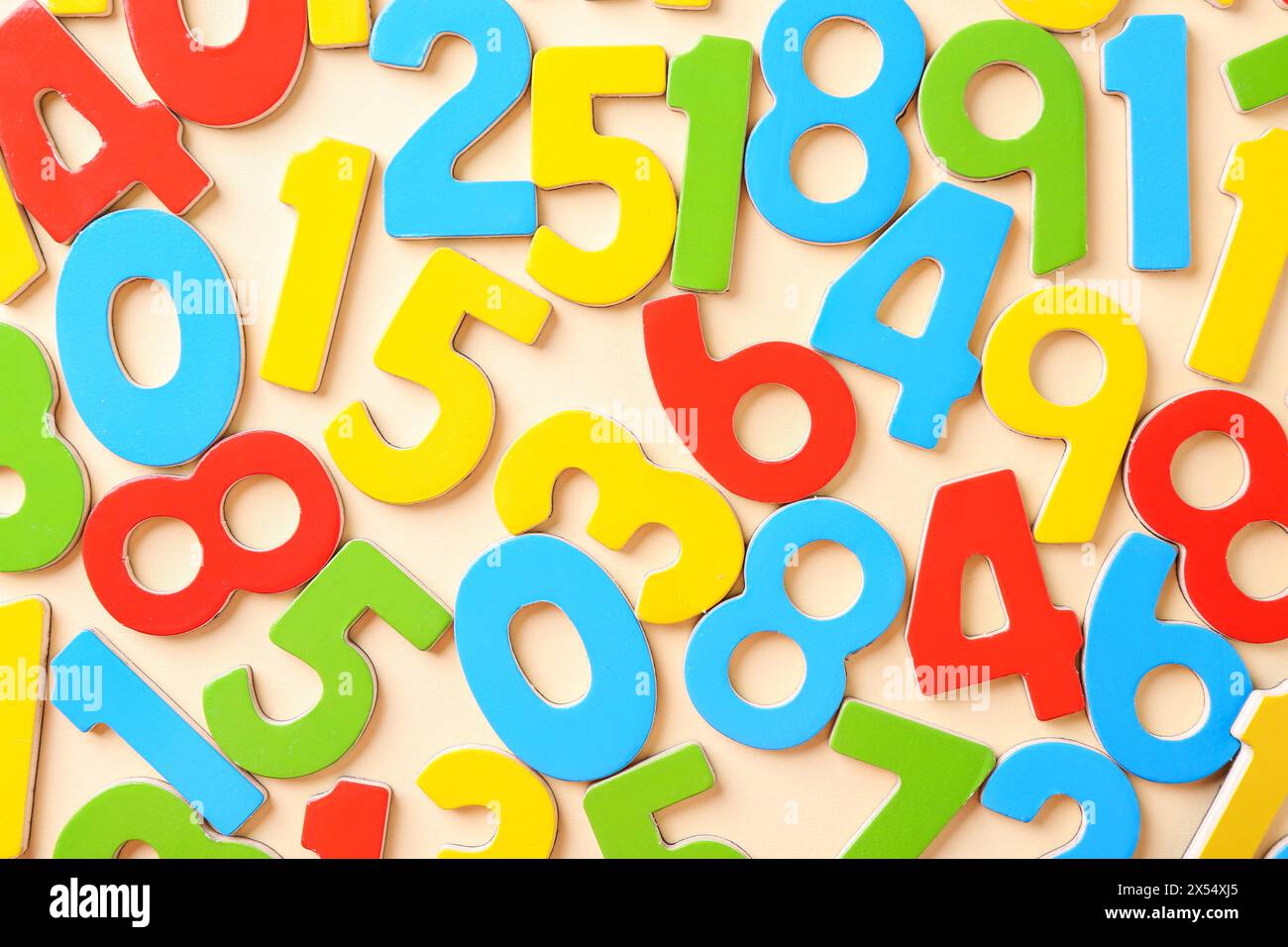Colorful numbers on beige background, flat lay Stock Photo - Alamy