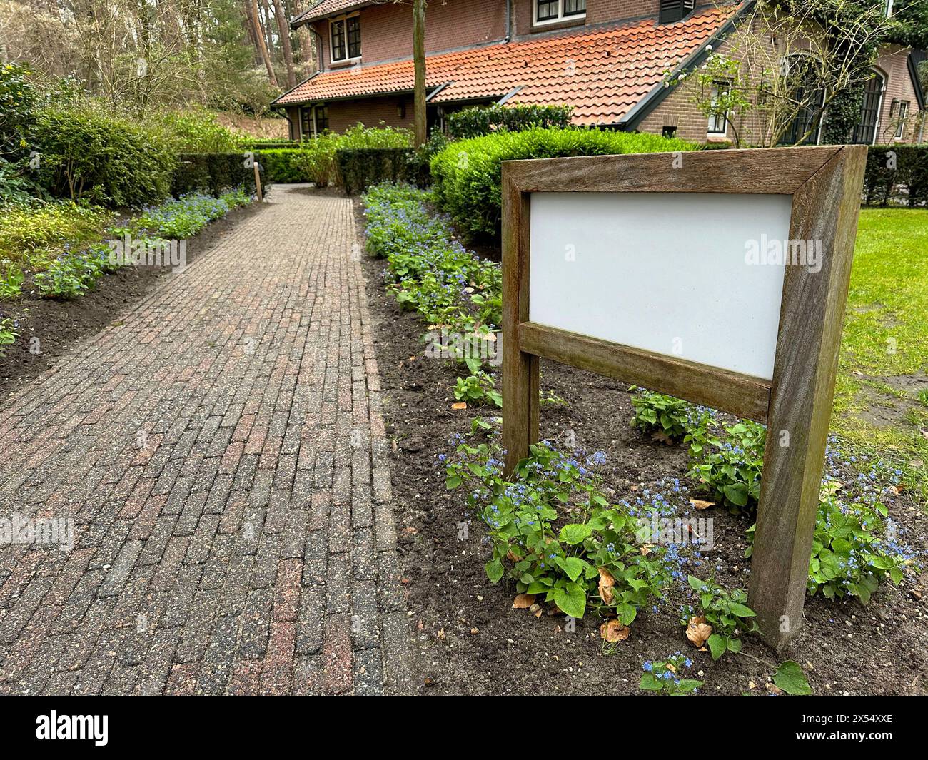 Luxury hotel, pathway and sign board outdoors Stock Photo - Alamy