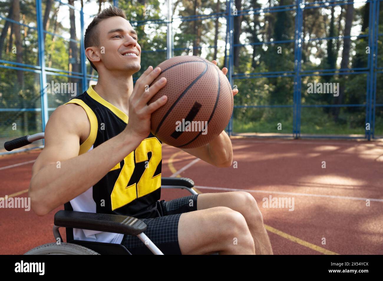 Handsome man with disability playing basketball in wheelchair Stock ...