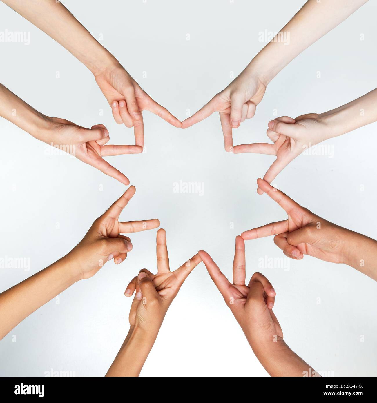 Children showing peace hand sign and standing in circle against grey ...