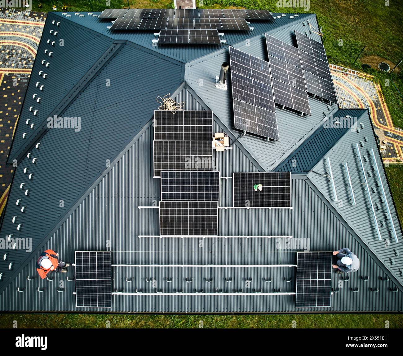 Aerial top view of new modern cottage with solar PV panels system on ...