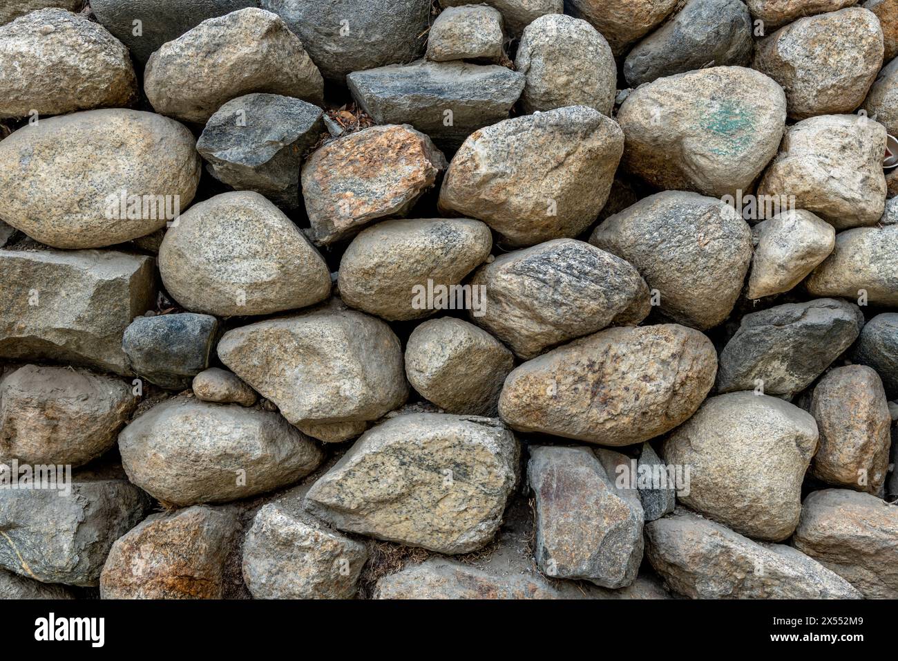 Different sizes and shapes of field stones in a rock wall in Turtok ...