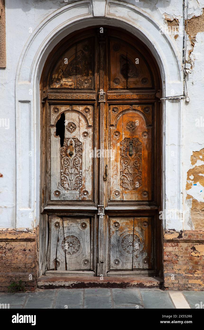 Old damaged wooden door in old house in Spain Stock Photo - Alamy