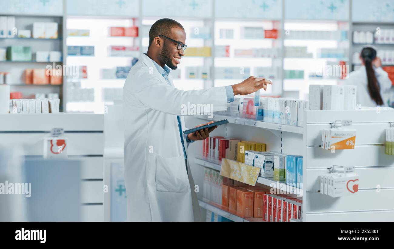 African man pharmacist uses hi-res stock photography and images - Alamy