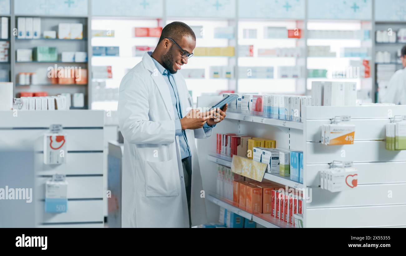 African man pharmacist uses hi-res stock photography and images - Alamy