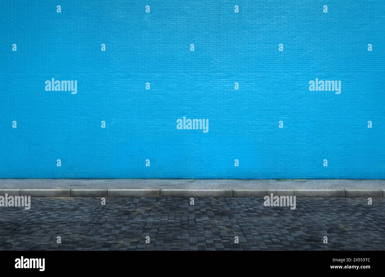 Big blue brick wall on street with sidewalk Stock Photo - Alamy