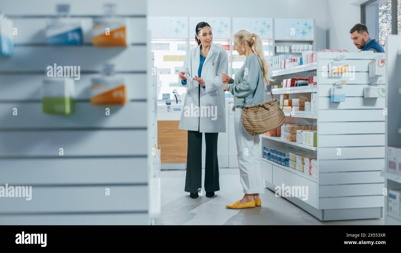 Pharmacy: Professional Pharmacist Helping Beautiful Senior Female ...