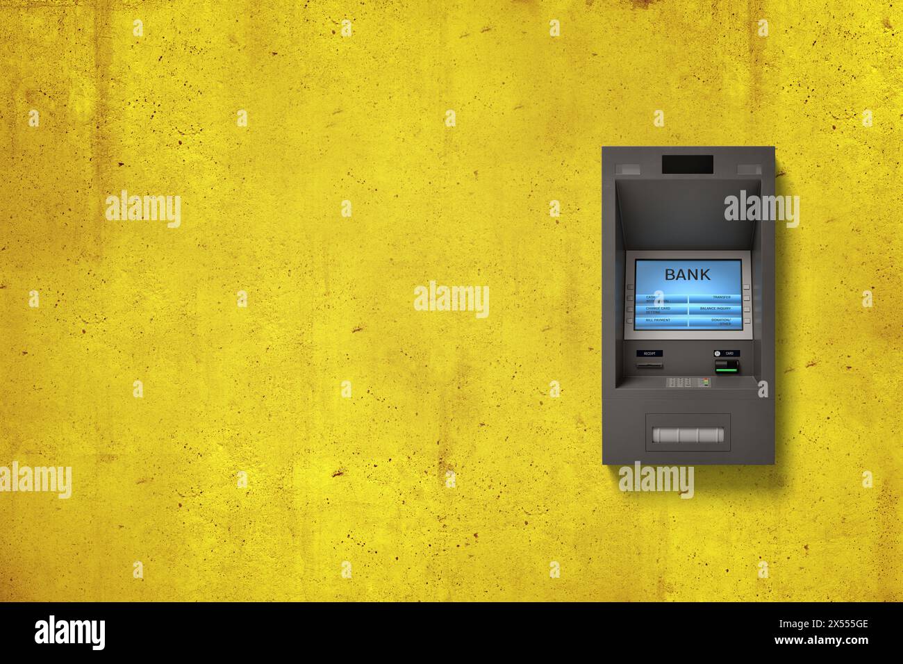 ATM machine on textured yellow wall background Stock Photo - Alamy
