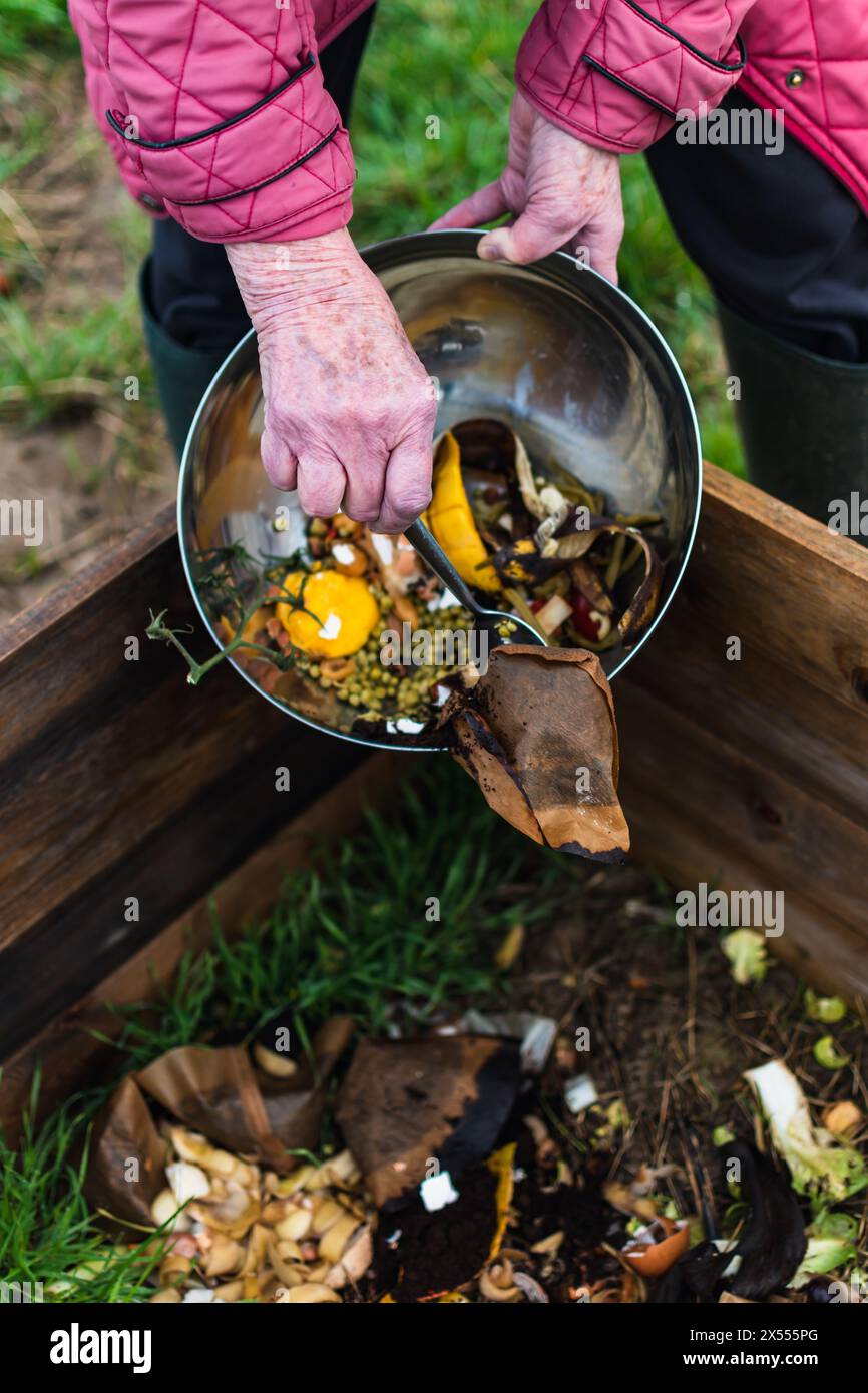 Person who put in a composter some kitchen waste like vegetables ...