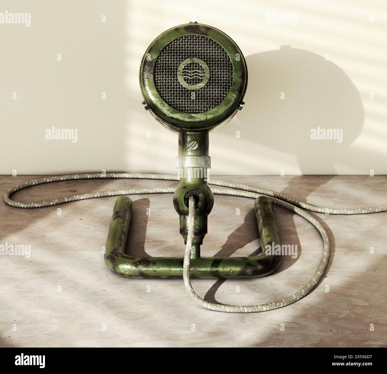 A vintage antique desk microphone on an isolated surface and wall ...