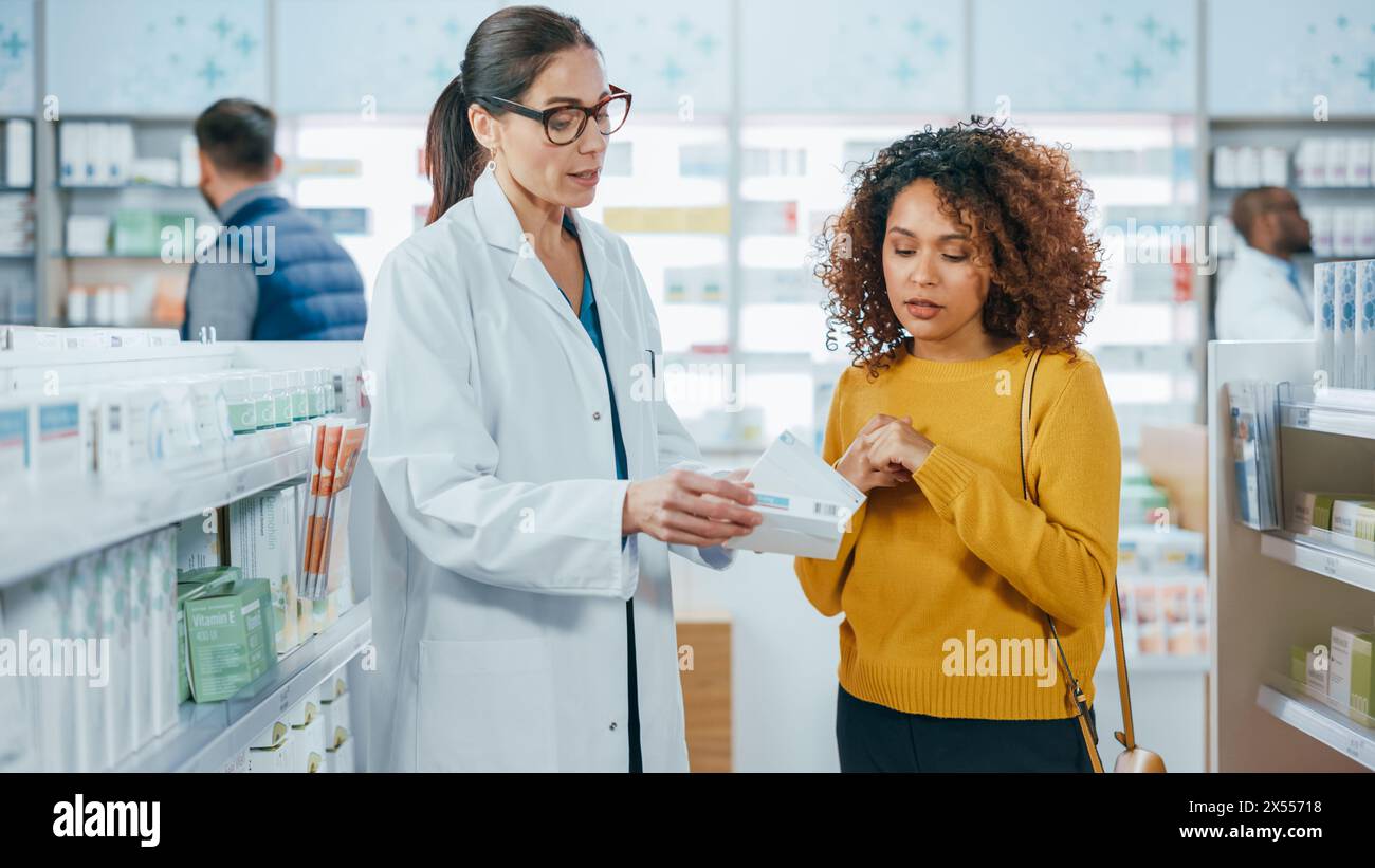 Pharmacy: Professional Caucasian Pharmacist Helping Beautiful Black ...