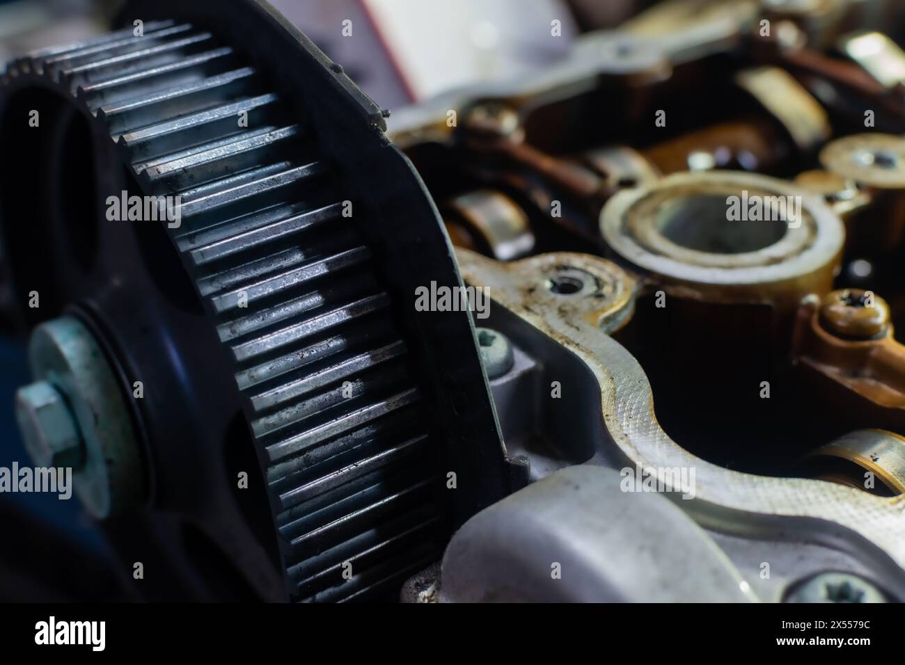 Camshaft gear of an internal combustion engine on blurred background of ...