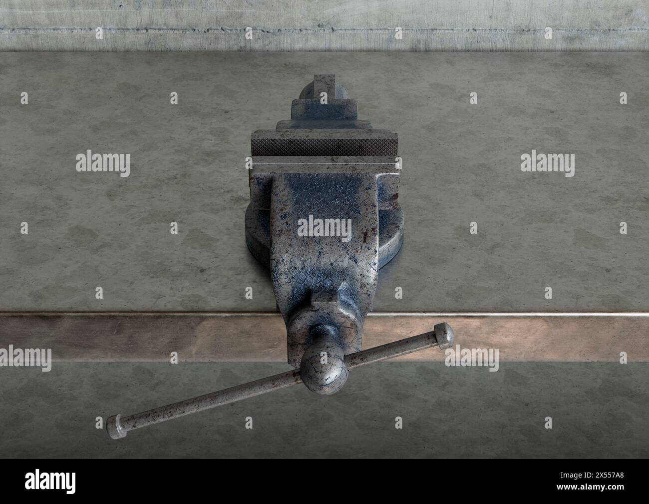 An industrial cast iron bench vice grip mounted on a metal workbench ...