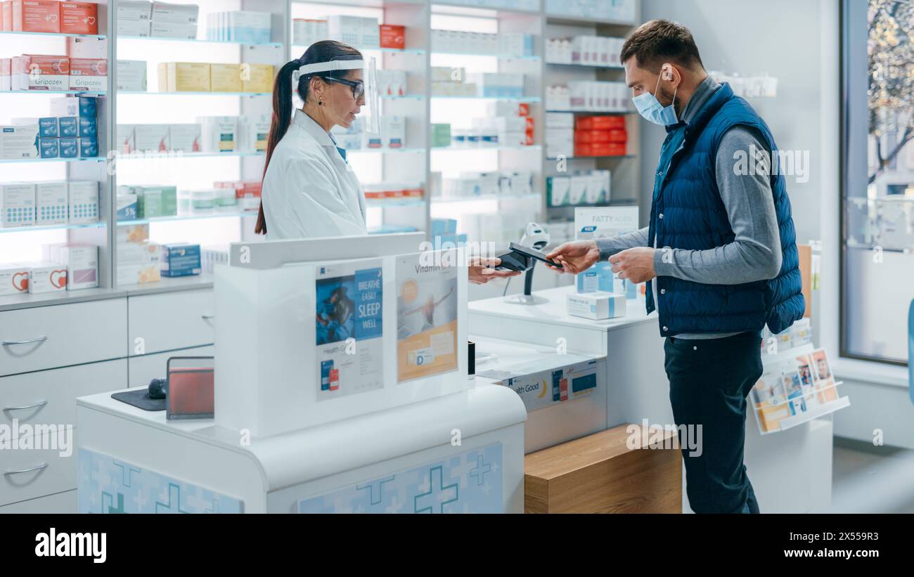Pharmacy Drugstore Checkout Counter: Female Pharmacist Wearing Face ...