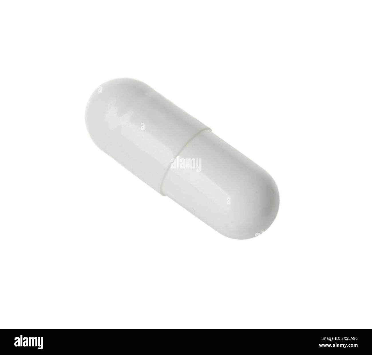 One vitamin capsule isolated on white. Health supplement Stock Photo ...