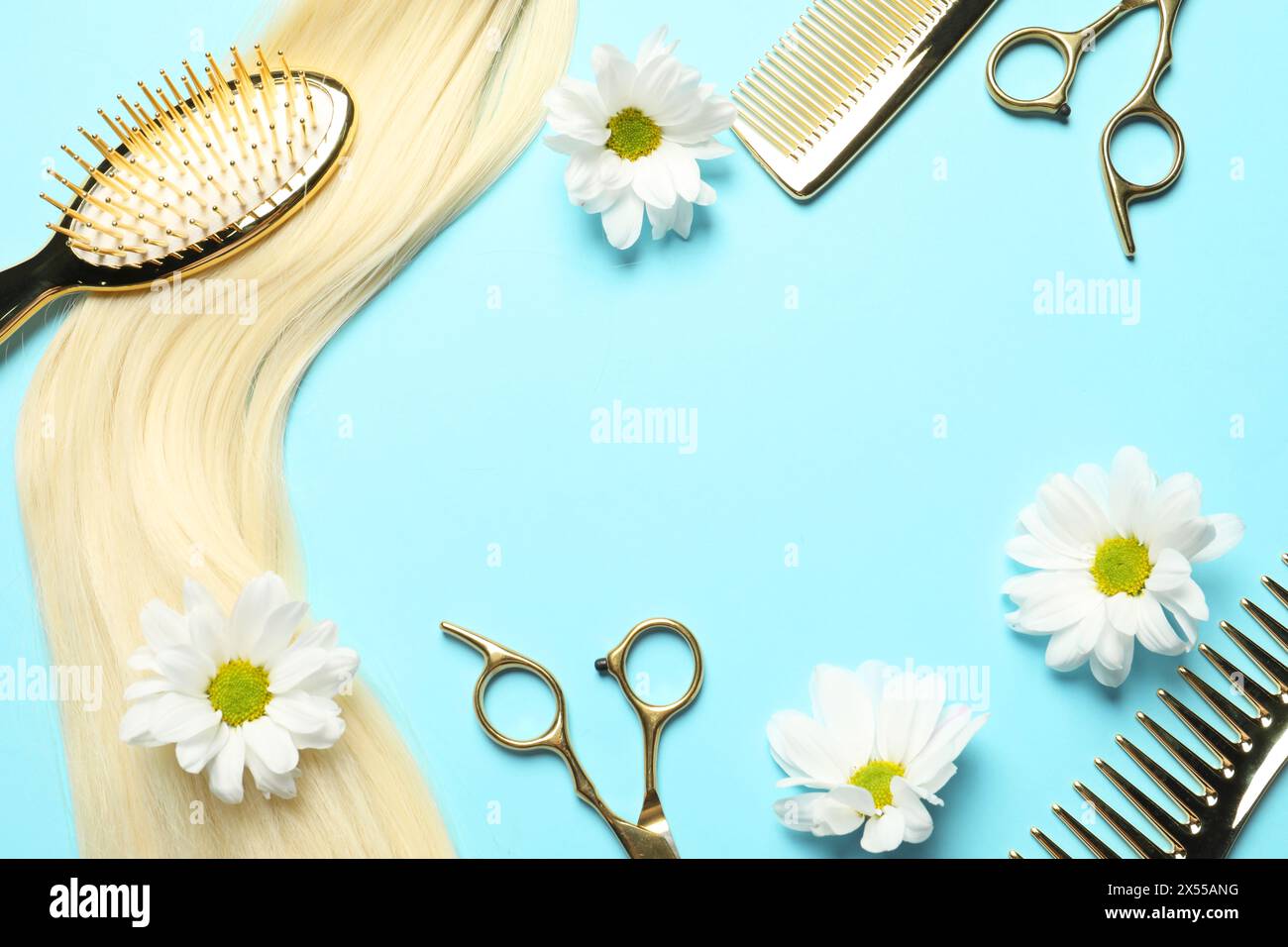 Flat lay composition with professional hairdresser tools, flowers and ...