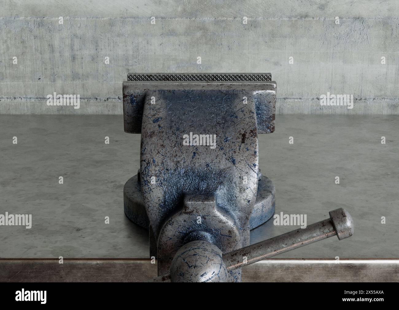 An industrial cast iron bench vice grip mounted on a metal workbench ...