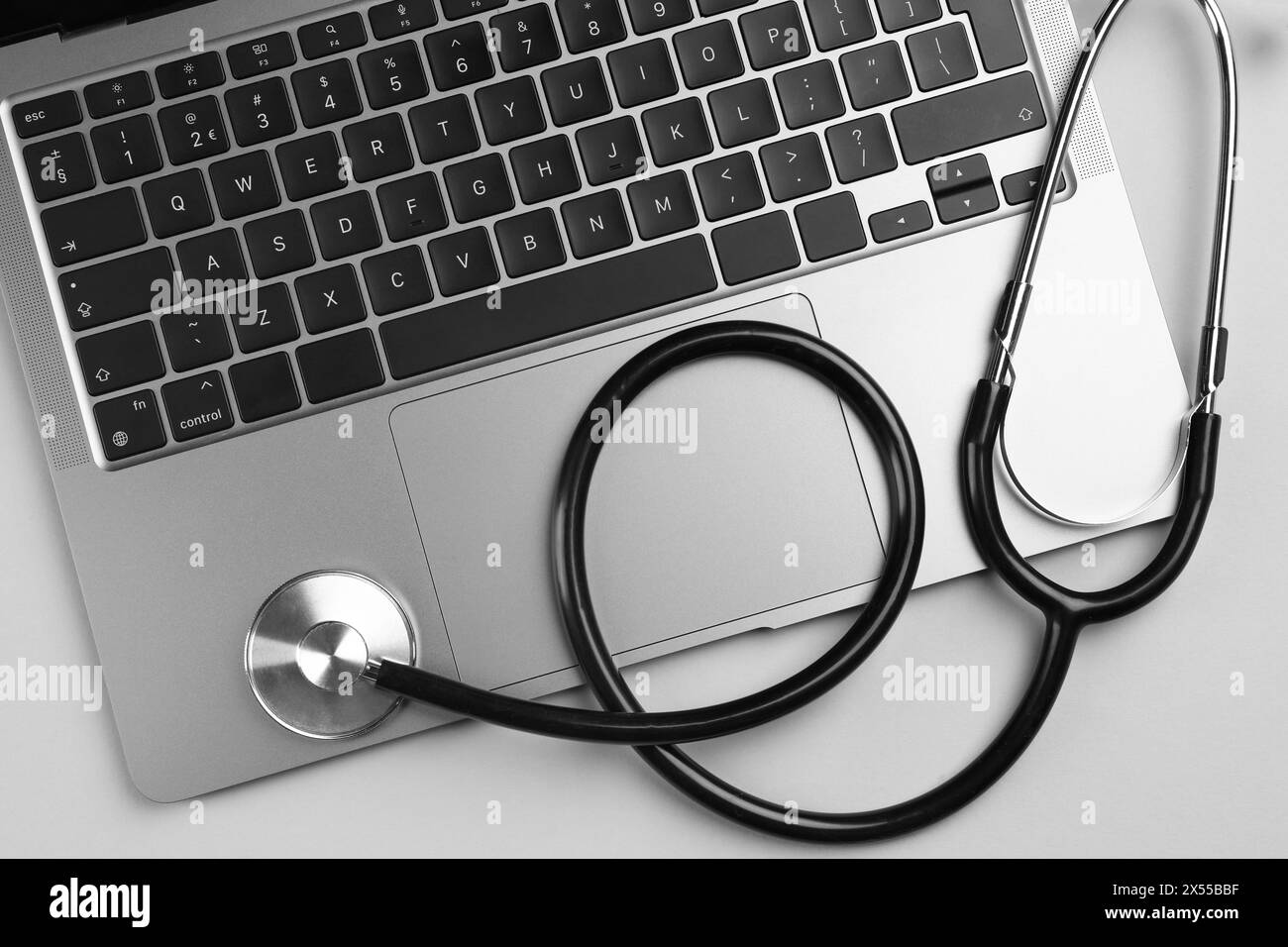 Laptop and stethoscope on light grey background, flat lay Stock Photo ...