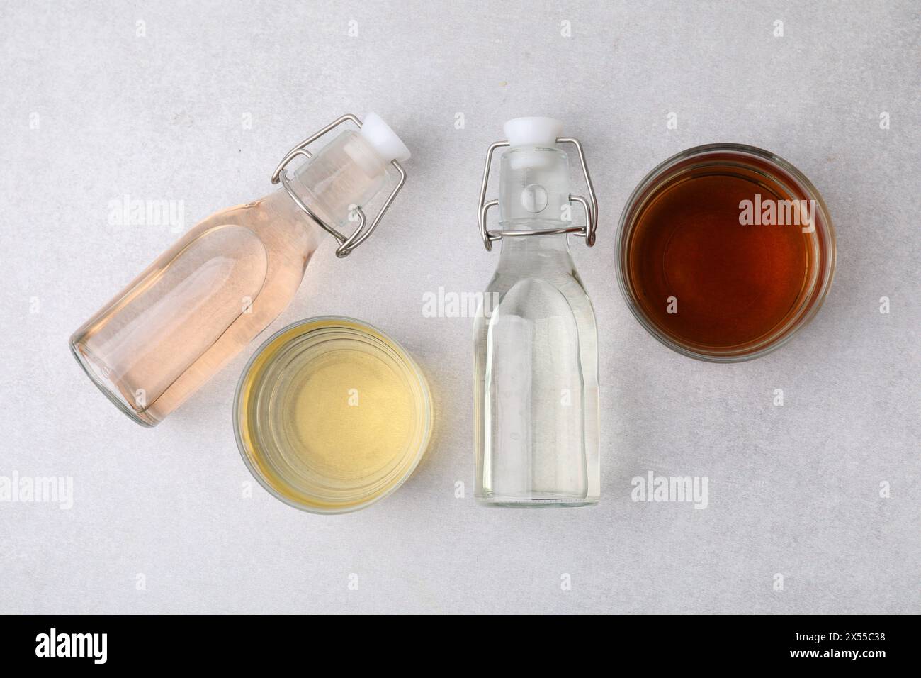 Different types of vinegar on light table, flat lay Stock Photo - Alamy