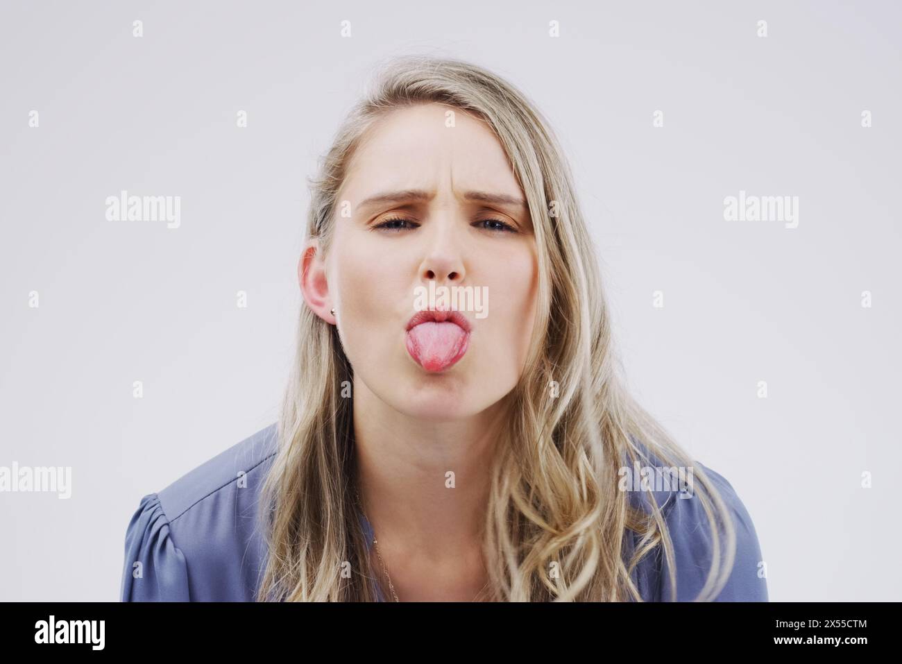 Studio, portrait and woman with tongue out, comic and goofy expression ...