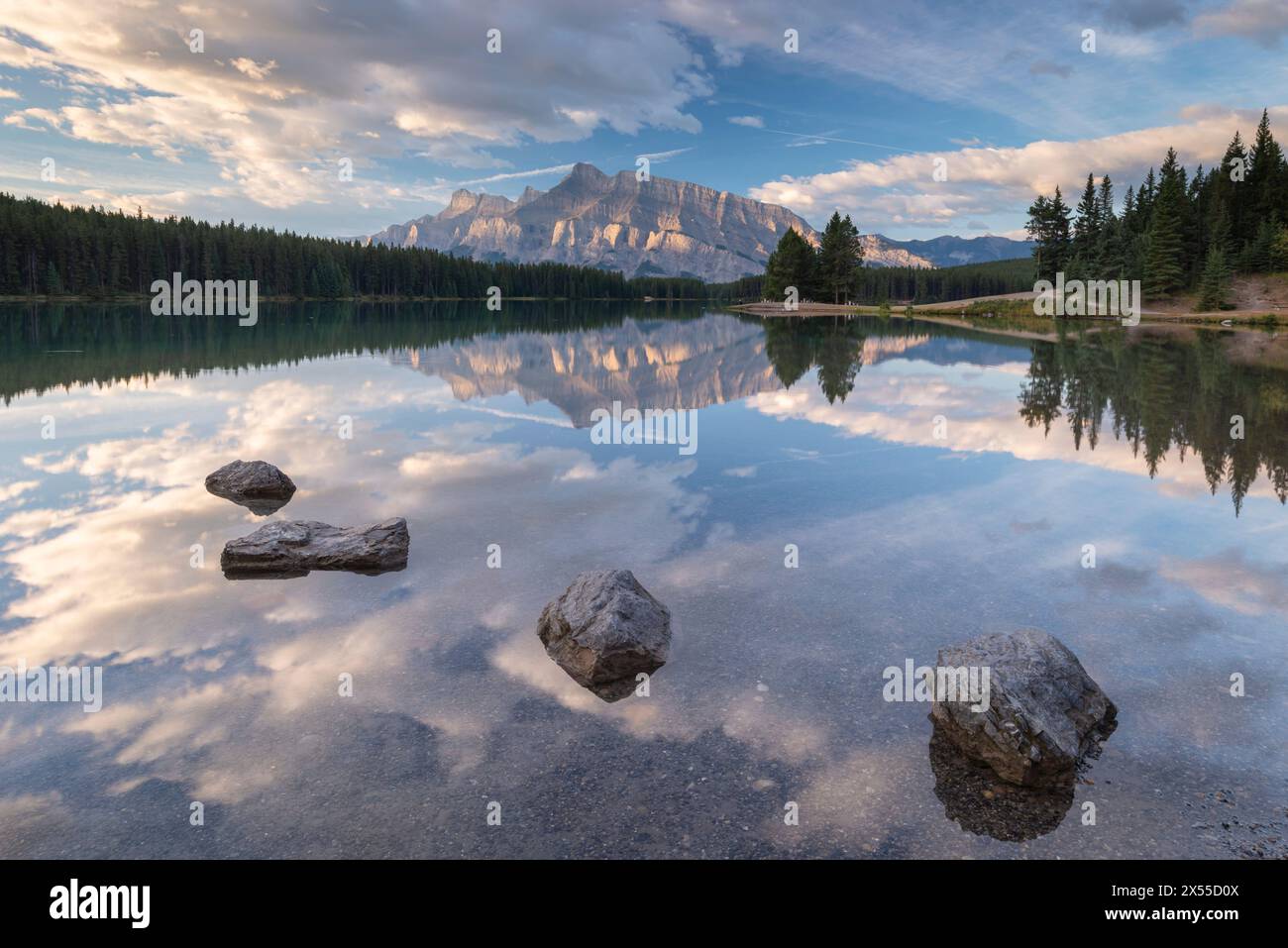 Mount Rundle reflected in the mirror still waters of Two Jack Lake in ...