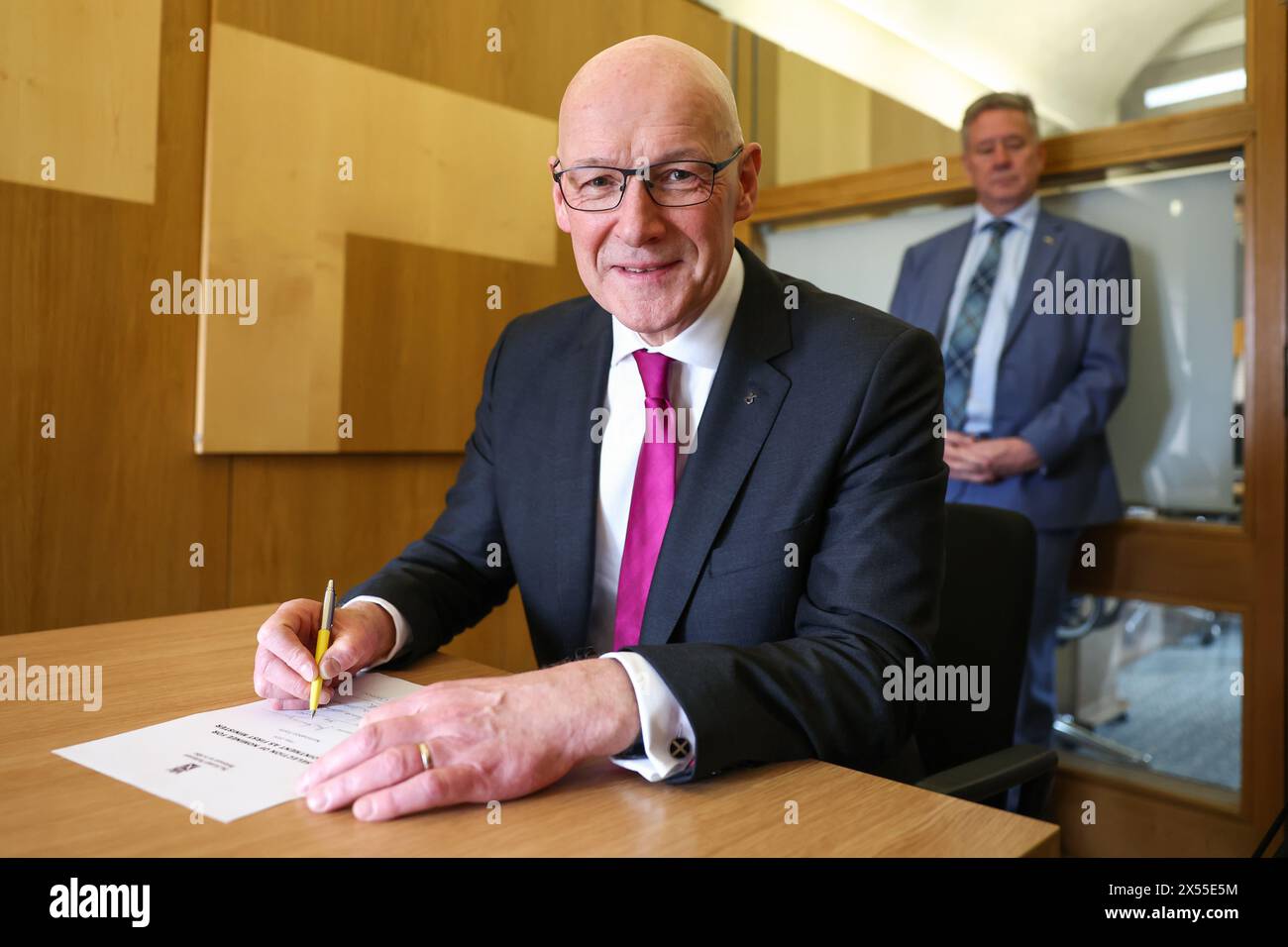New Scottish National Party (SNP) leader John Swinney signs his letter ...