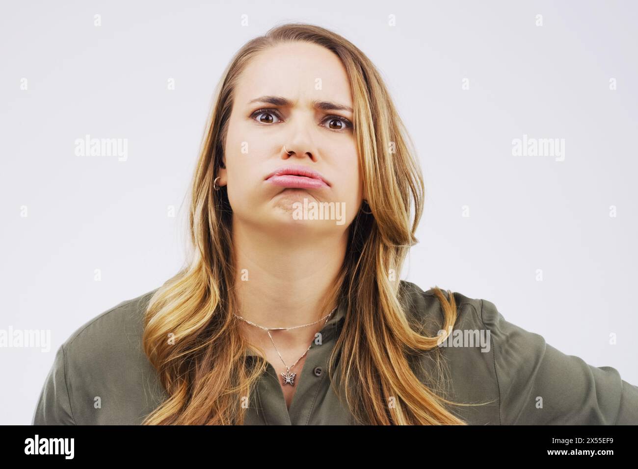 Funny face, woman and portrait in studio for annoyed, humor and silly ...