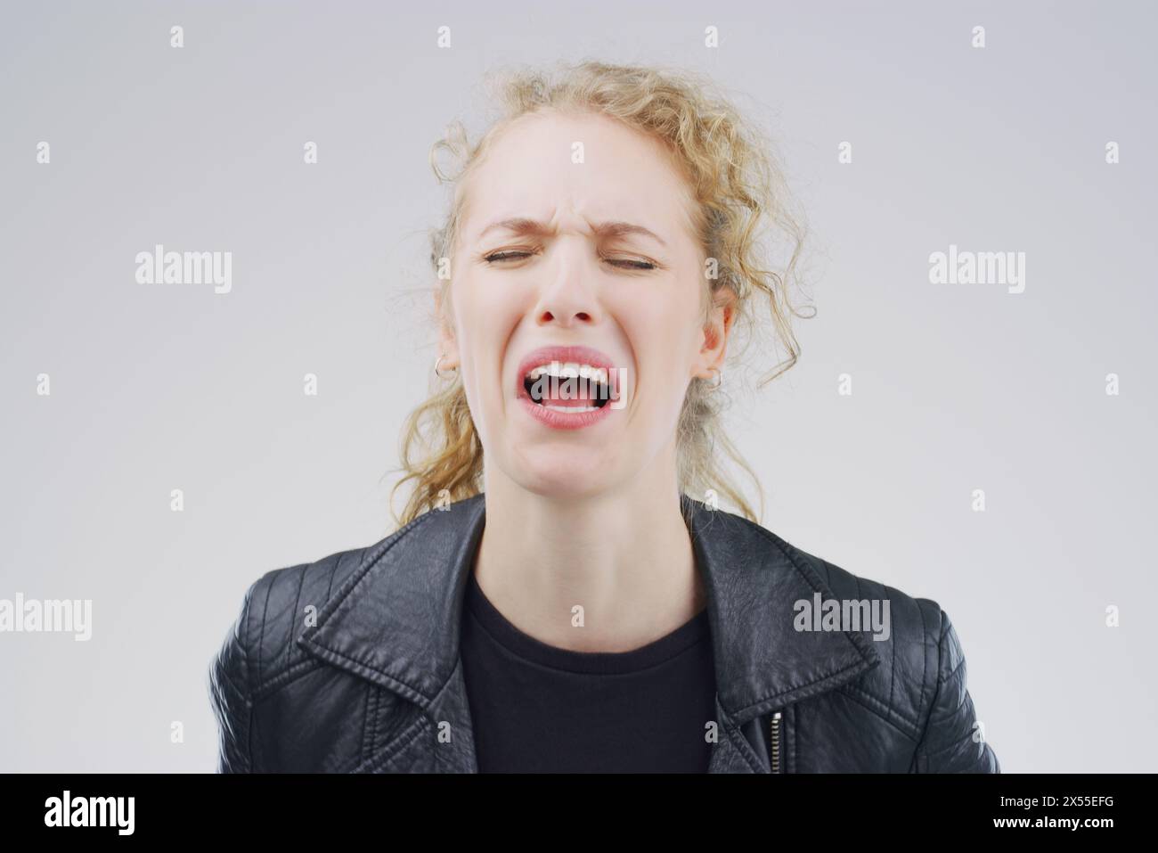 Crying, screaming and sad woman in studio with depression, crisis and ...