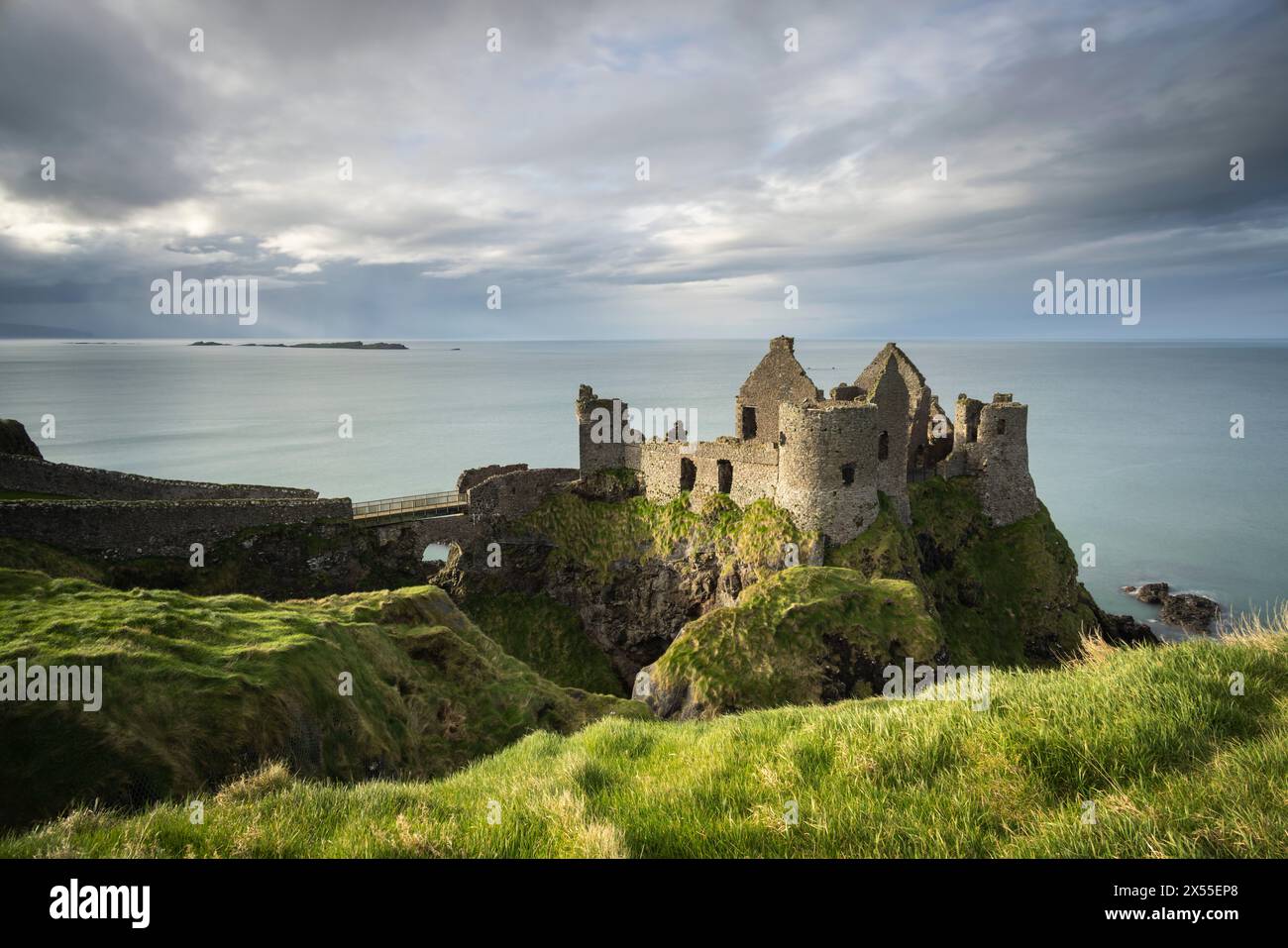 The ruins of Dunluce Castle on the clifftops of the Causeway Coast ...