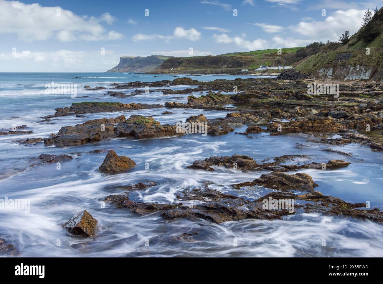 View over rocky ledges towards Fair Head, Ballycastle Beach ...