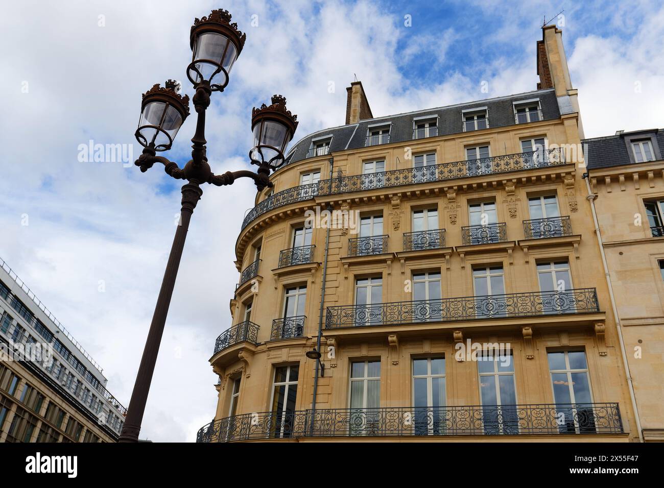 The facade of traditional French house with typical balconies and ...