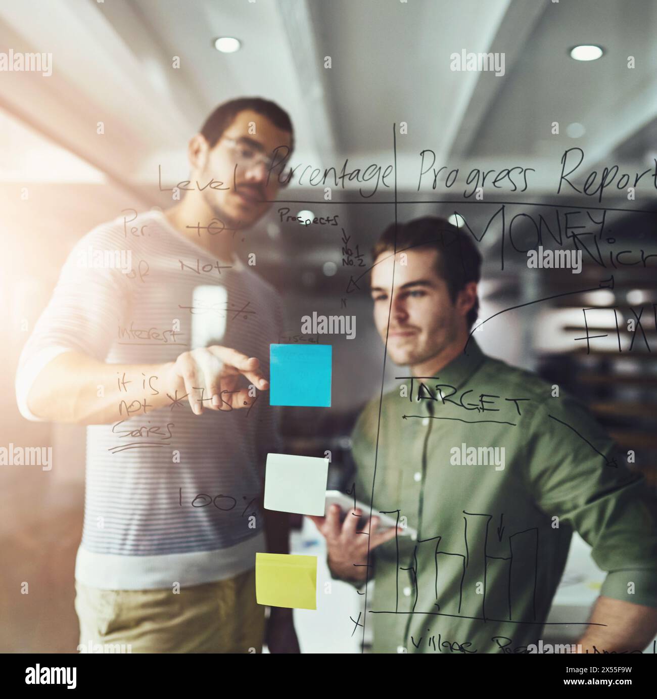 Businessman writing notes graphs planning hi-res stock photography and ...