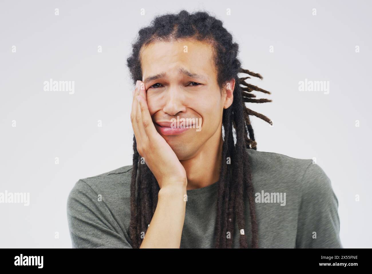 Crying, portrait and sad man in studio with anxiety, worry and broken ...
