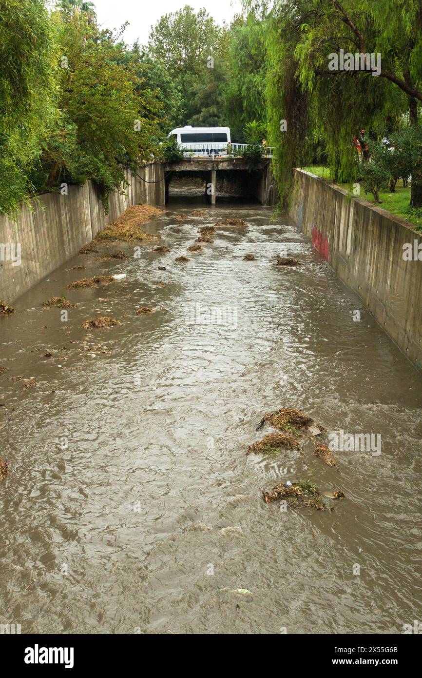 Dirty flow city storm drain Stock Photo - Alamy