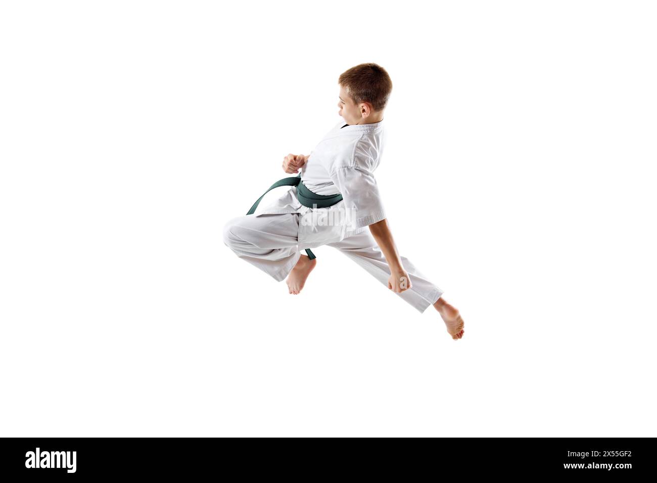 Dynamic image of teen bot, karate athlete in motion, kicking in a jump ...