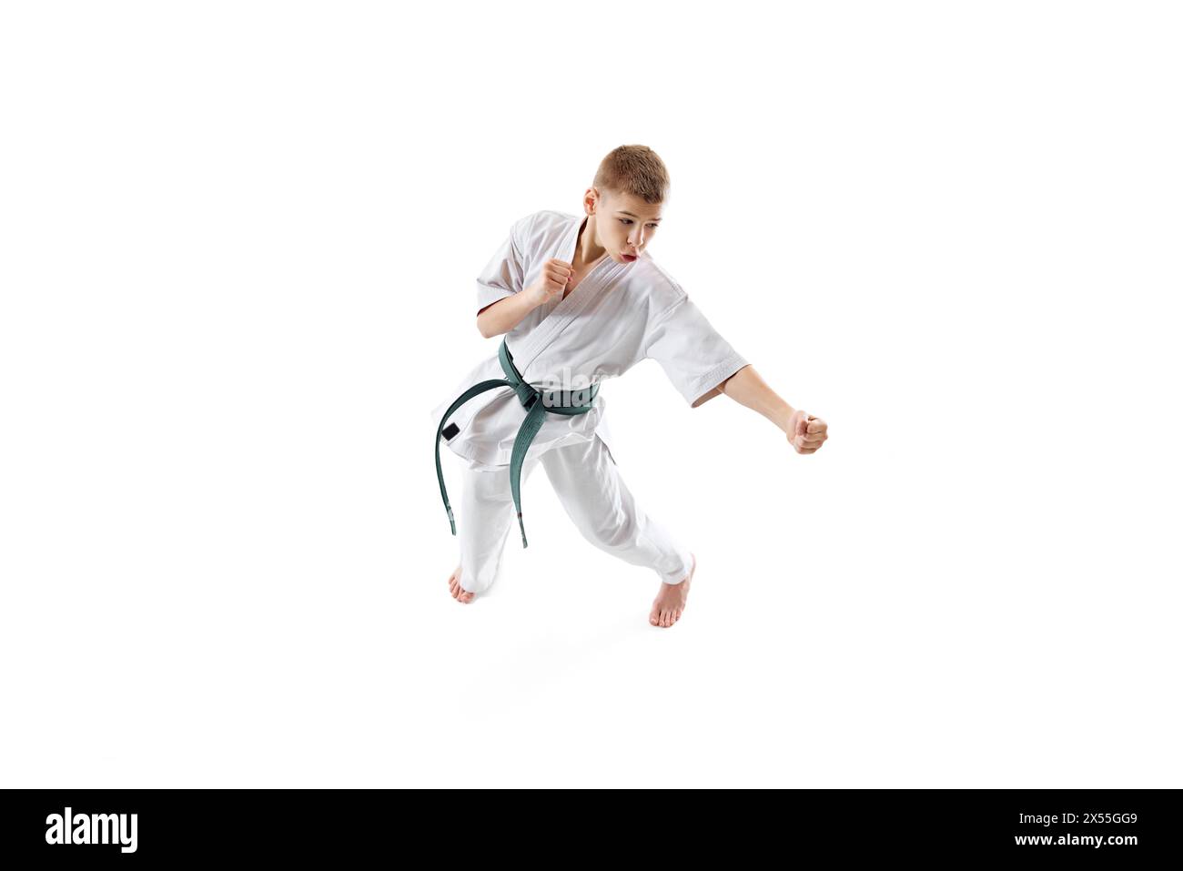 Top view on dedicated young martial artist training, standing in ...