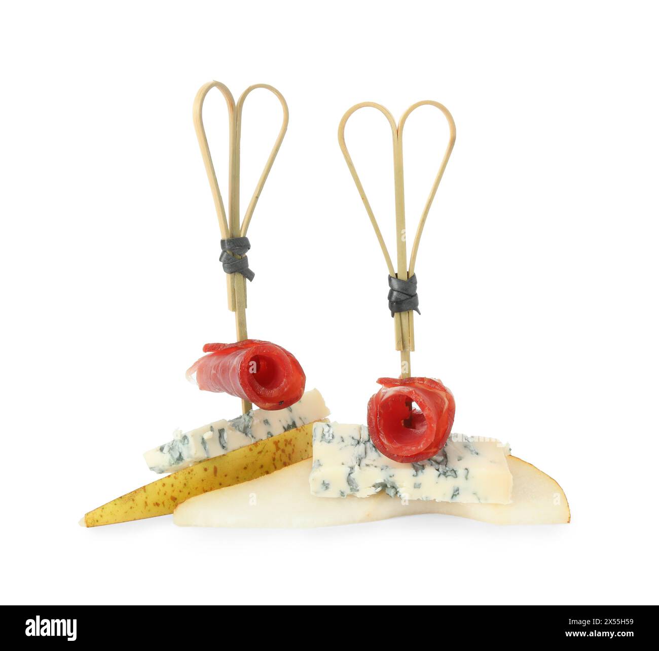 Tasty canapes with pears, blue cheese and prosciutto isolated on white ...