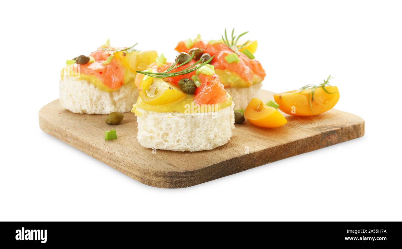 Tasty canapes with salmon, tomatoes, capers and herbs isolated on white ...
