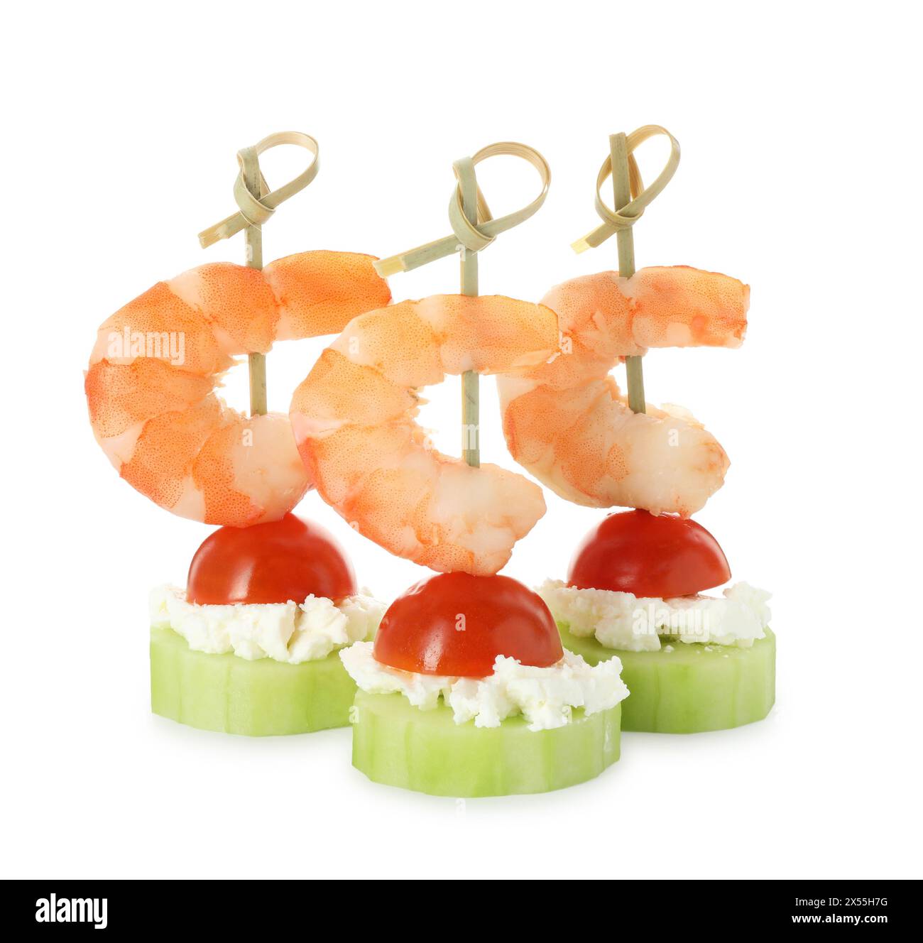 Tasty canapes with shrimps, vegetables and cream cheese isolated on ...