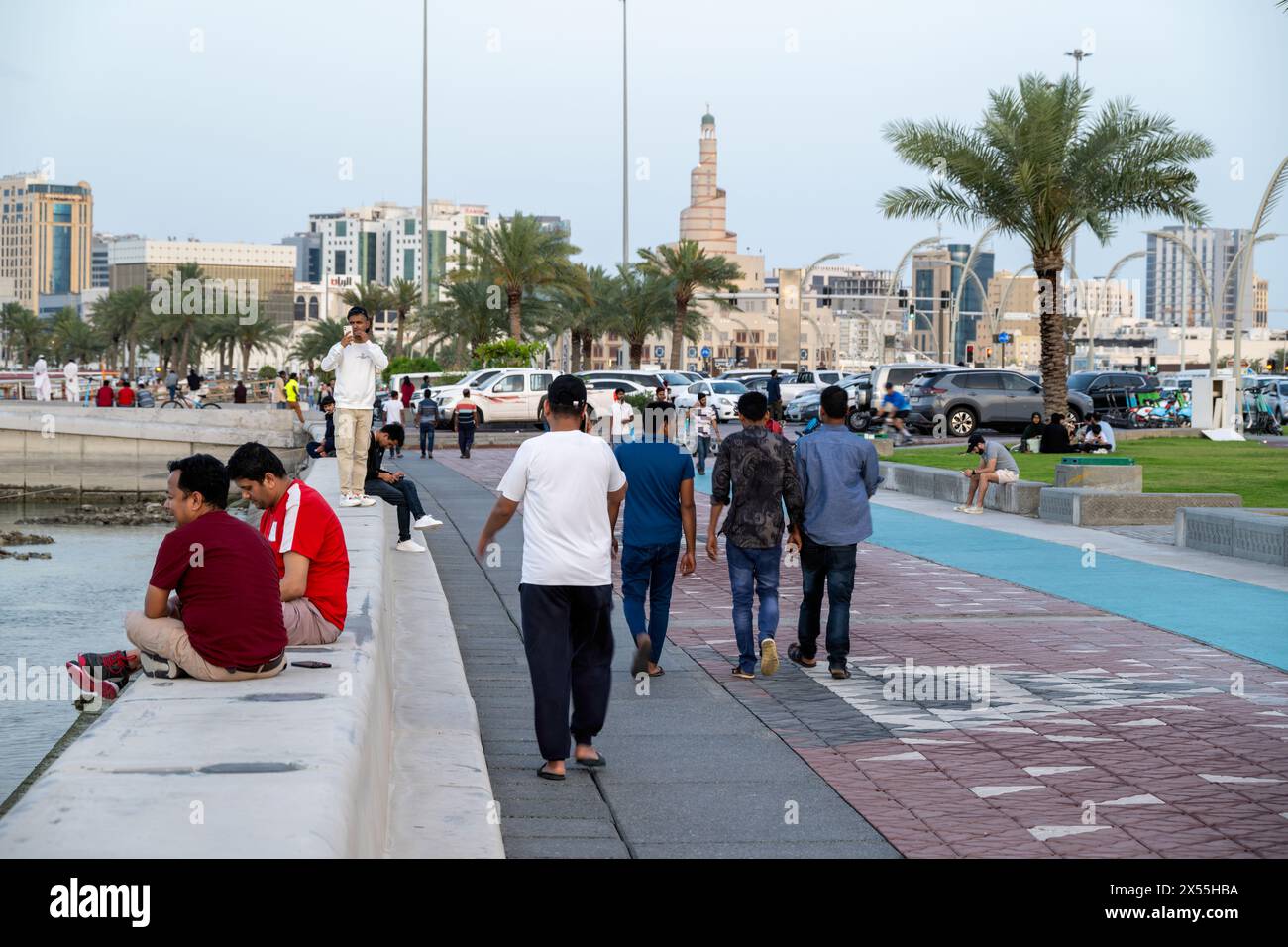 People enjoying holiday cold weather on Corniche beach Doha Qatar Stock ...