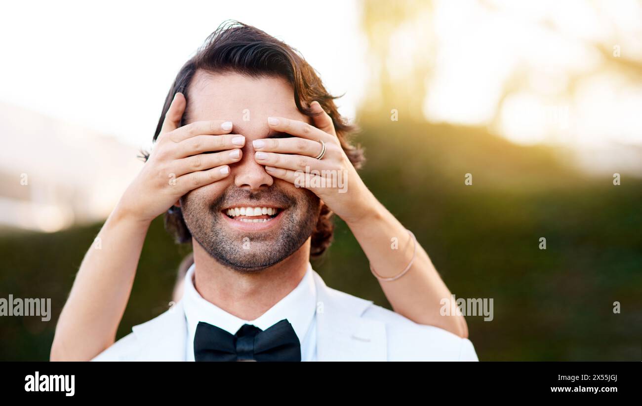 Couple, wedding and surprise with hands on eyes for happy reveal at ...